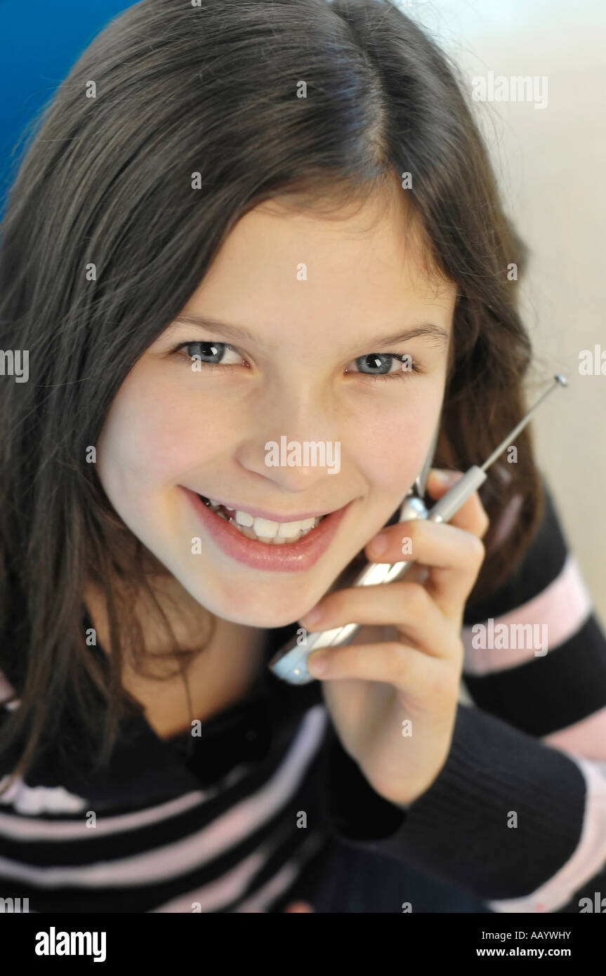 Tween talking on a cell phone Stock Photo - Alamy