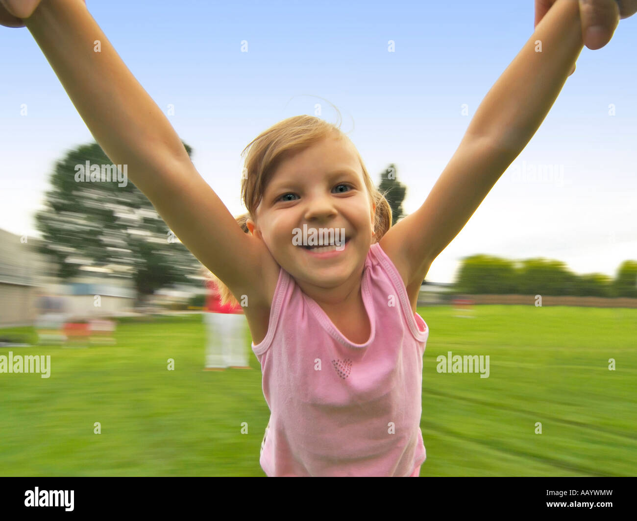 Close up of young girl spinning Stock Photo - Alamy