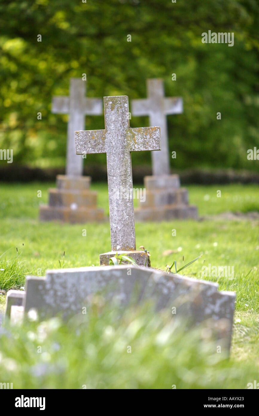 Three graves in a churchyard Stock Photo - Alamy