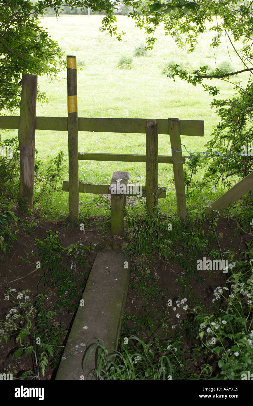 Stile and bridge over ditch Stock Photo - Alamy