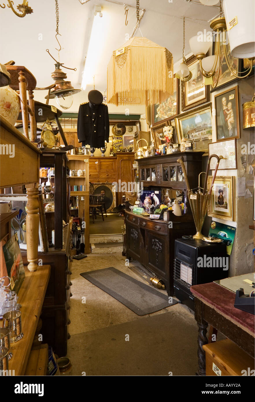 Old furniture in a British antiques shop store interior, England, UK ...