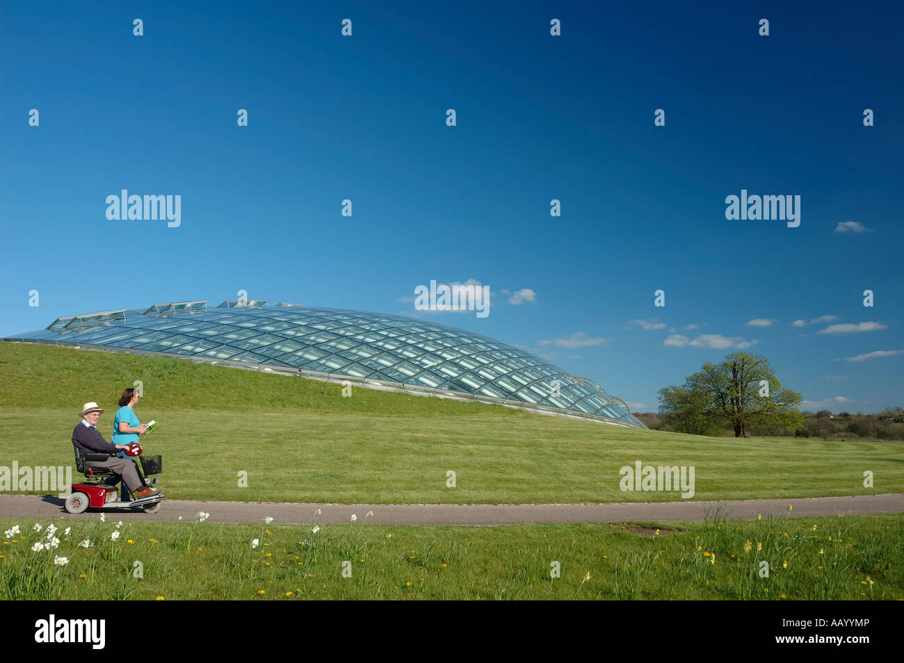 The 'dome' glasshouse at the Welsh Botanical Bardens with two visitors ...