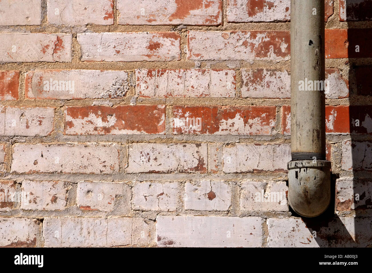 Conduit pipe leading into brick wall in Moose Jaw in scenic ...