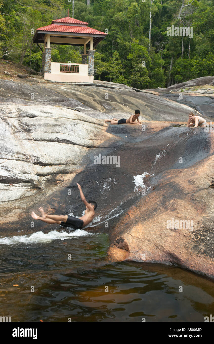 Sliding in the Seven Wells waterfall. Langkawi island, Malaysia Stock ...