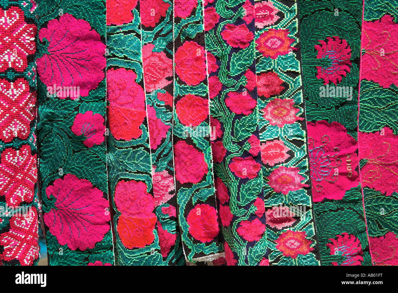 Colourful embroidered gifts for sale outside gift shop, Palenque ...