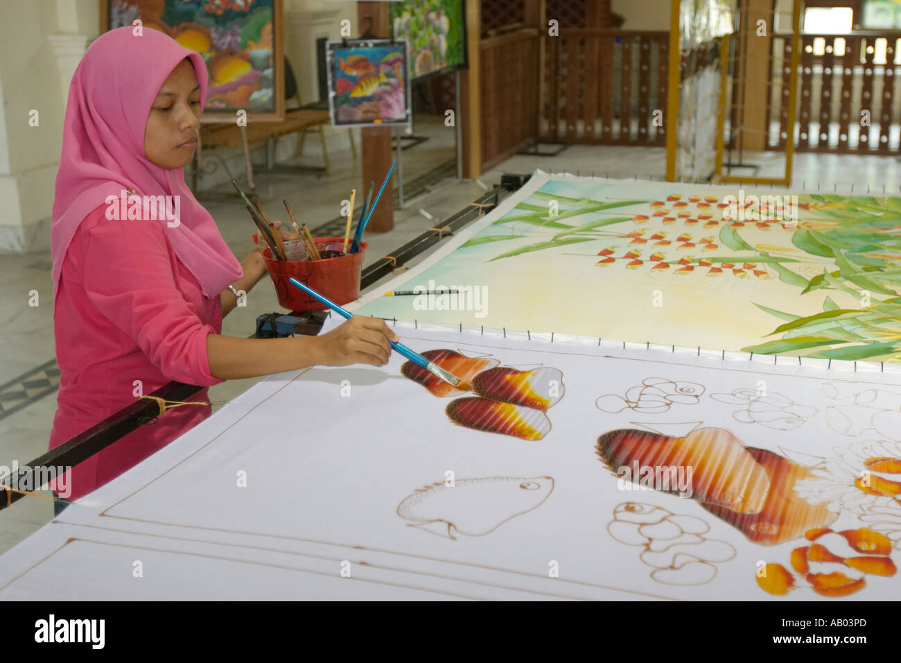 Muslim woman artist painting batik at Langkawi Handicraft Cultural ...