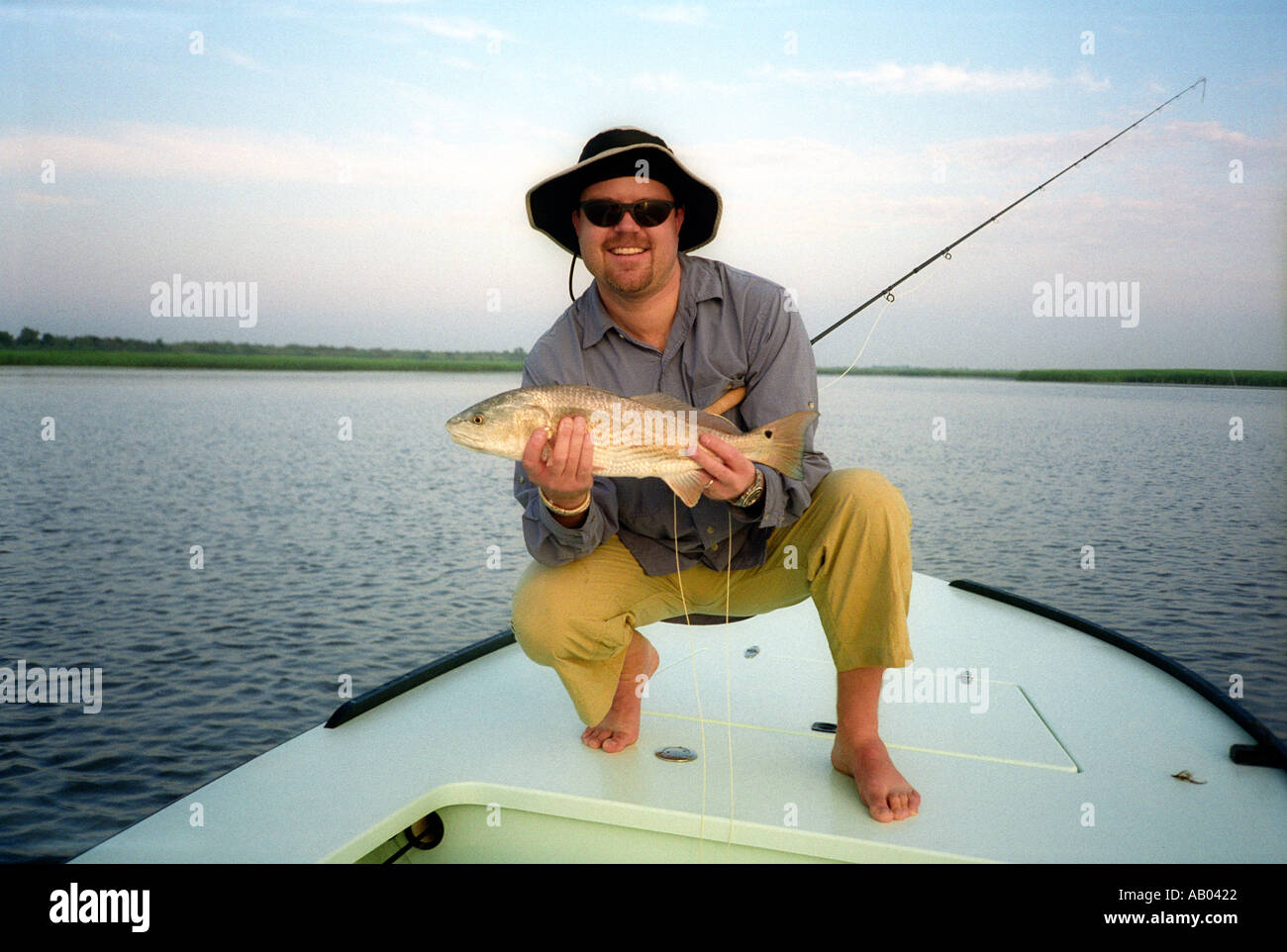 Man holding redfish caught while fly fishing in Savannah Georgia USA ...