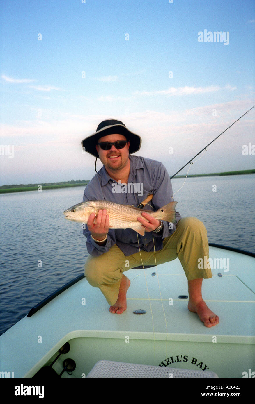 Man holding redfish caught while fly fishing in Savannah Georgia USA ...