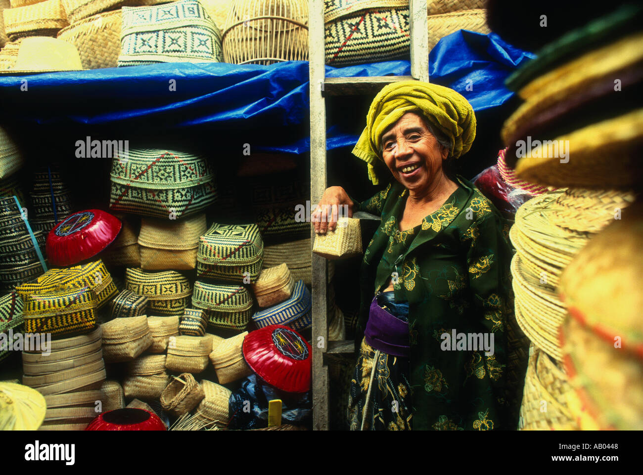 Woman selling baskets in public market on the island of Bali in ...