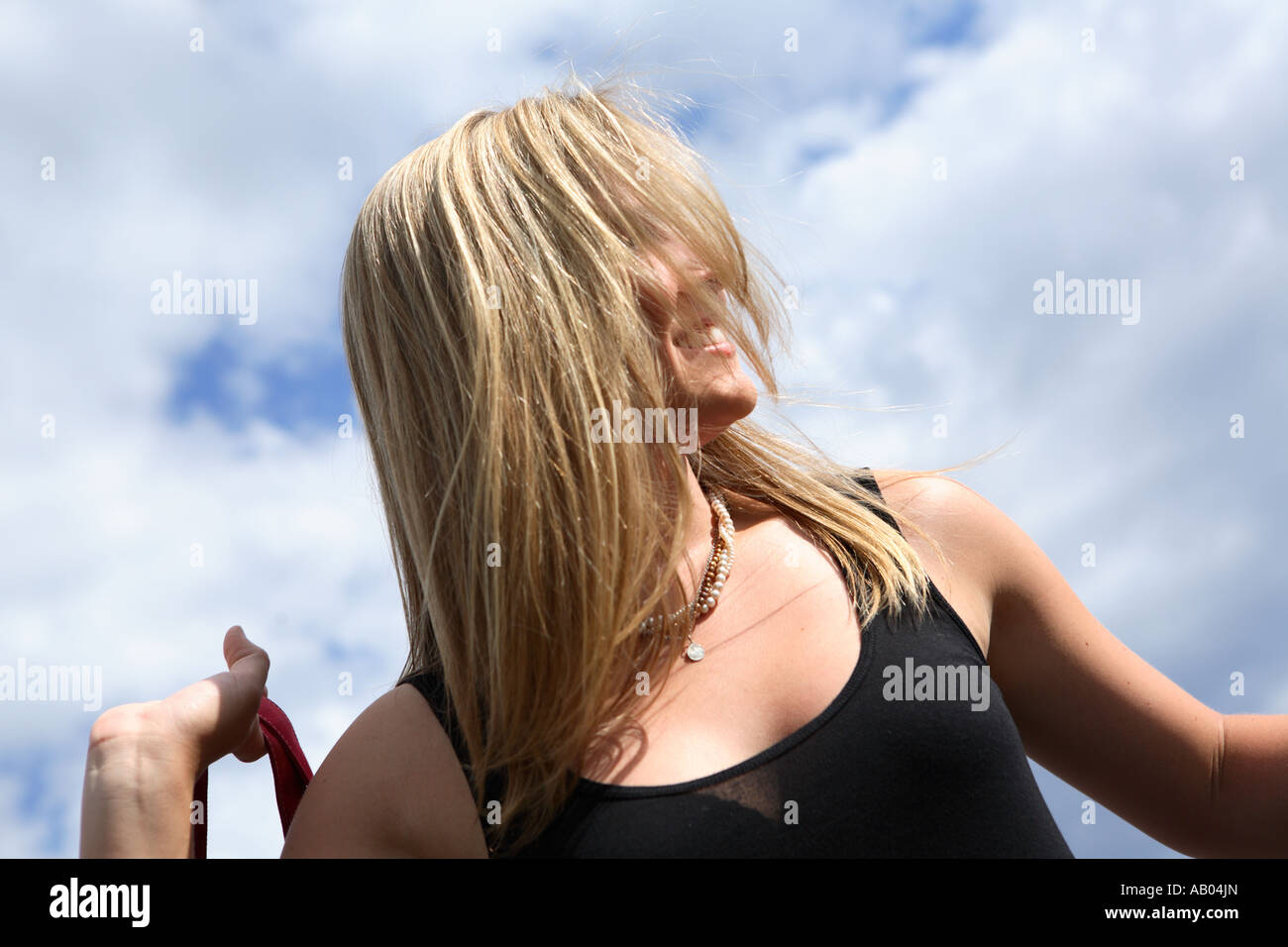 Teenage girl with hair over face Stock Photo - Alamy