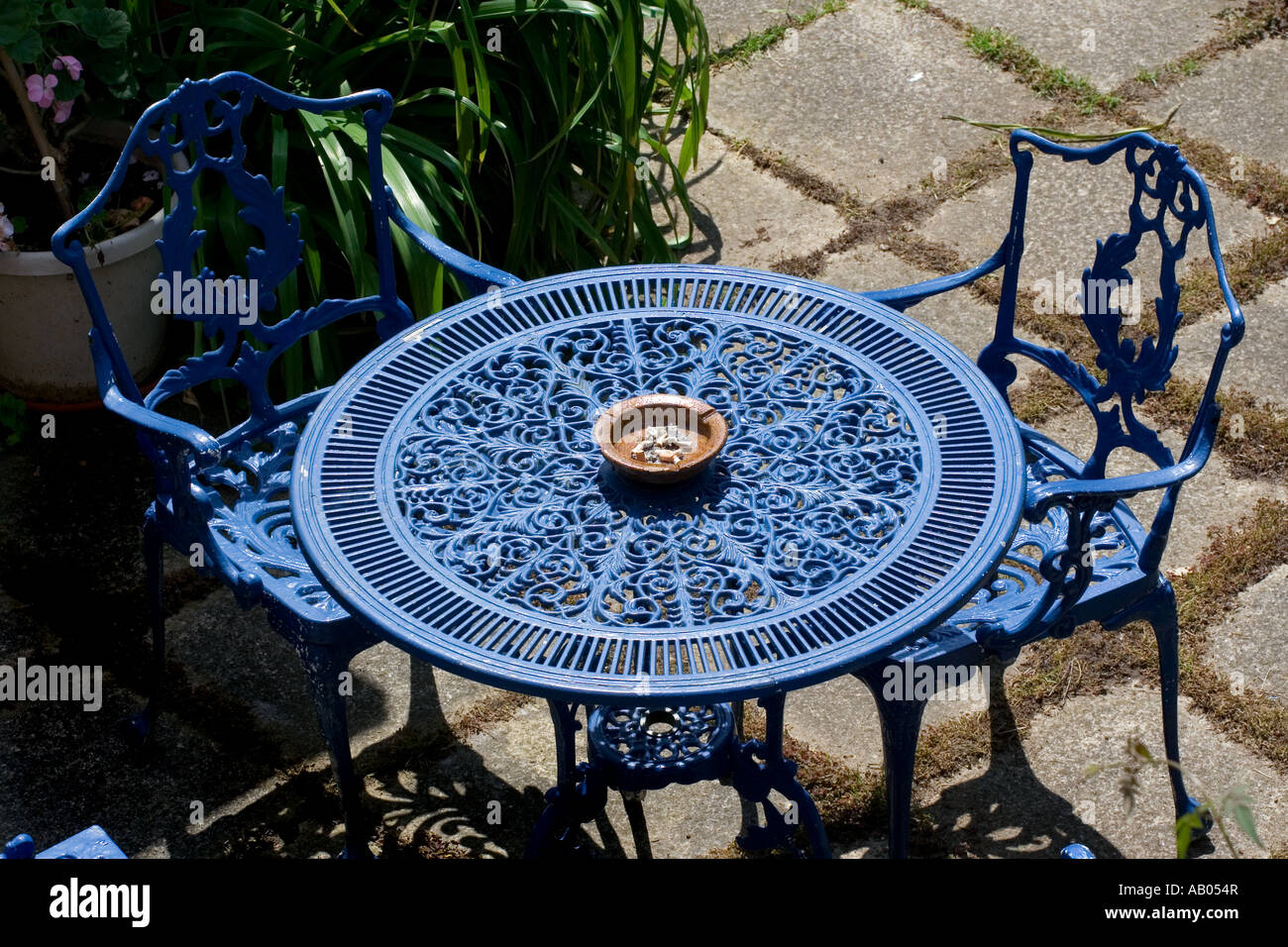 Outdoor blue metal table and chairs Stock Photo - Alamy