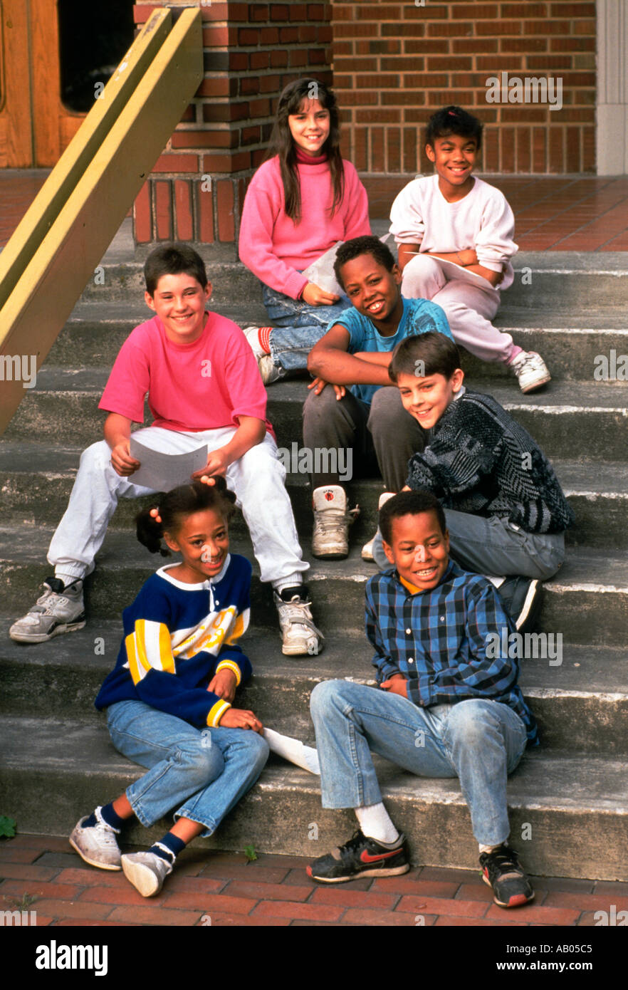Children sitting on steps Stock Photo - Alamy