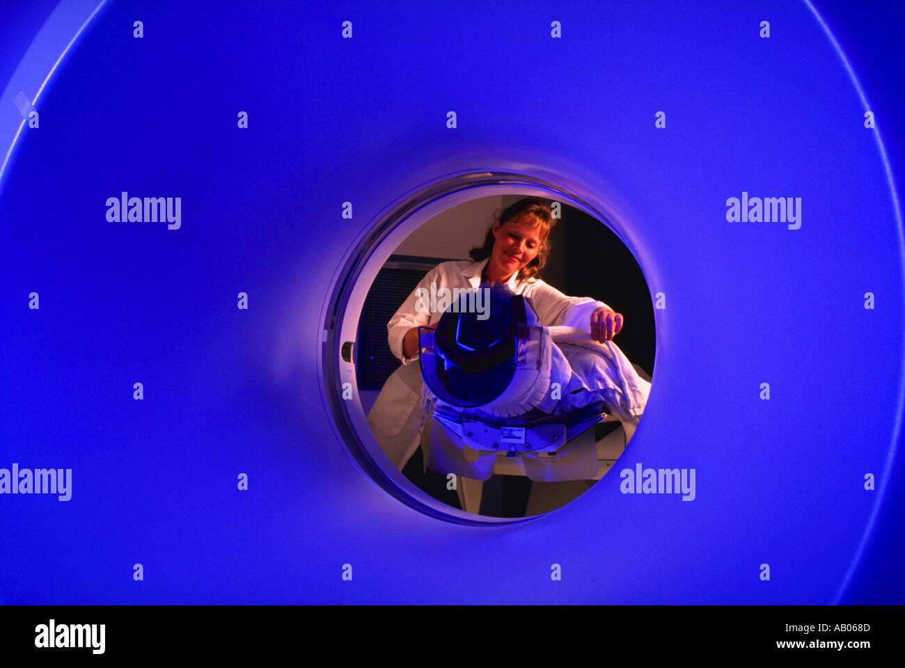 Nurse preparing patient for CT scan while explaining procedure Stock ...