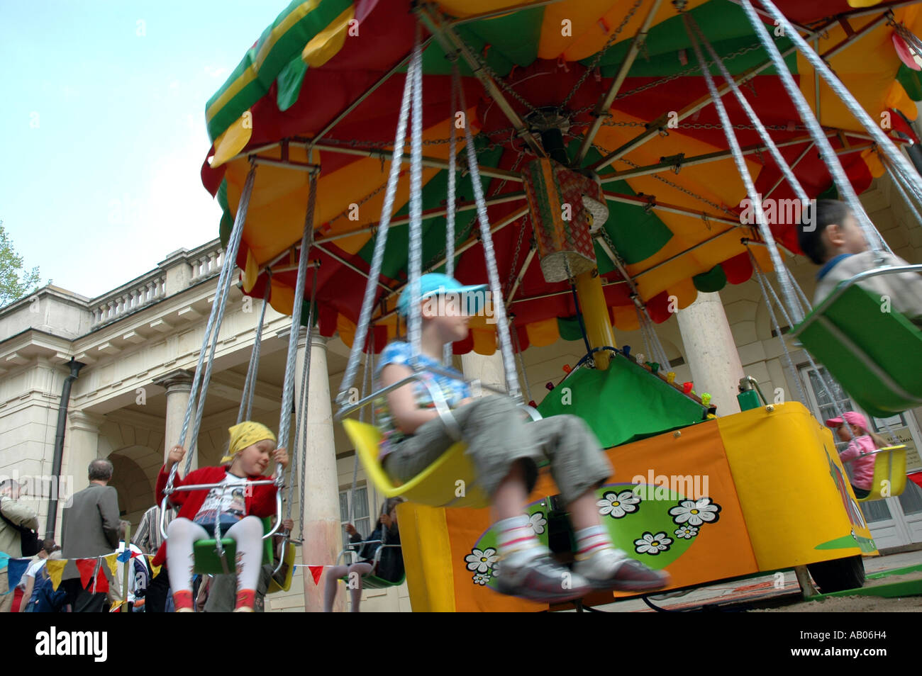 Kids on carousel Stock Photo - Alamy