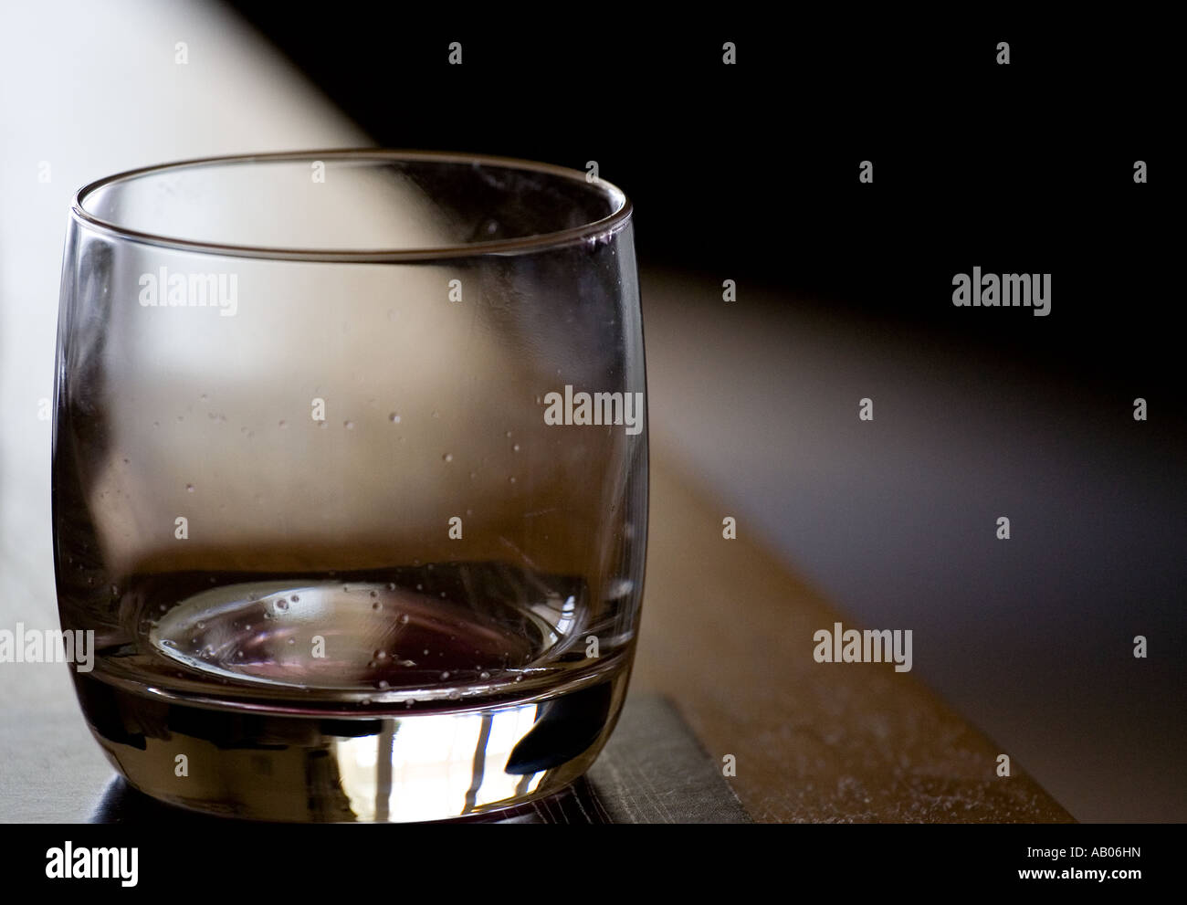 empty glass on table in natural light Stock Photo - Alamy
