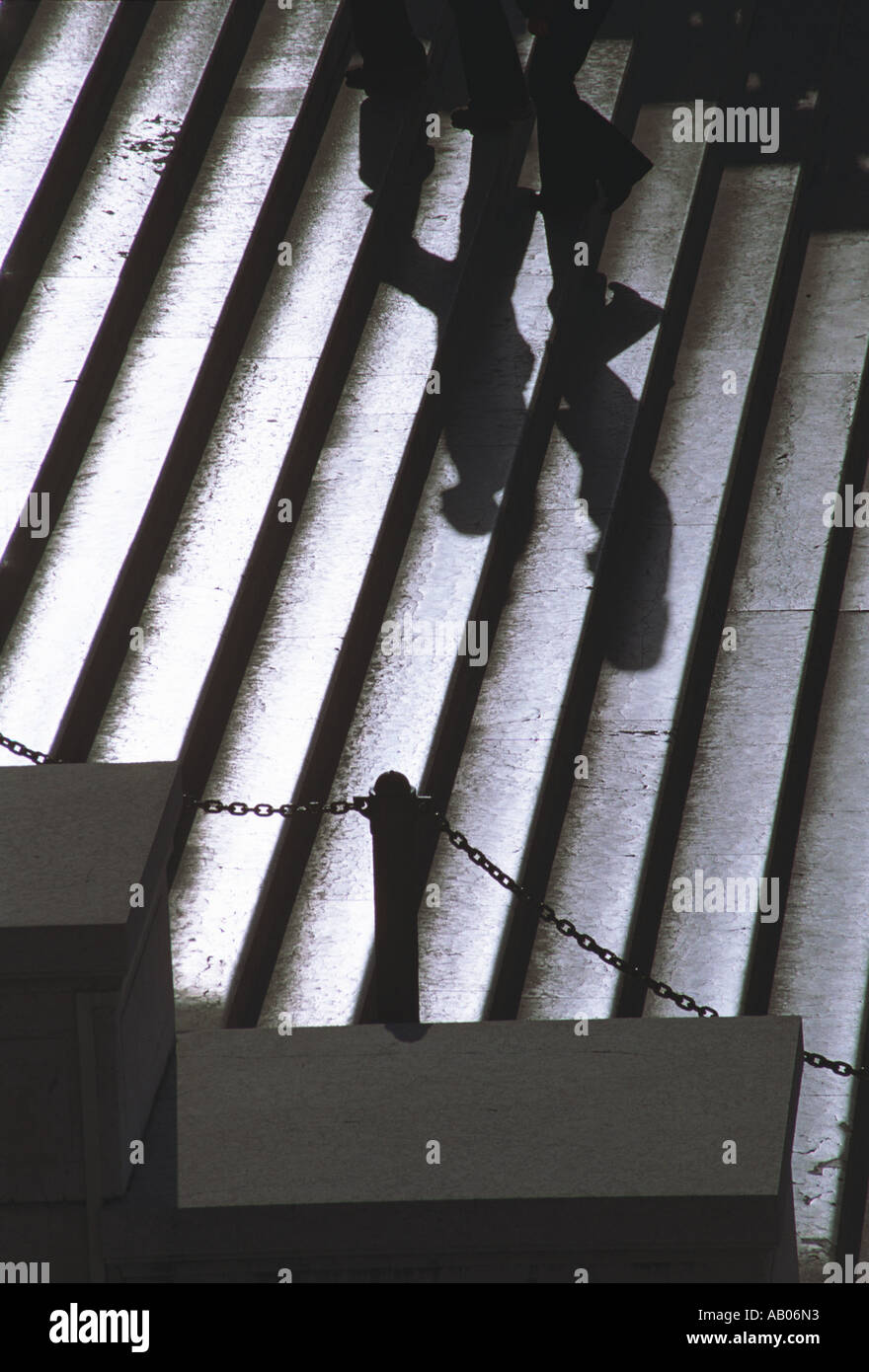 shadow of two people walking up steps Stock Photo - Alamy