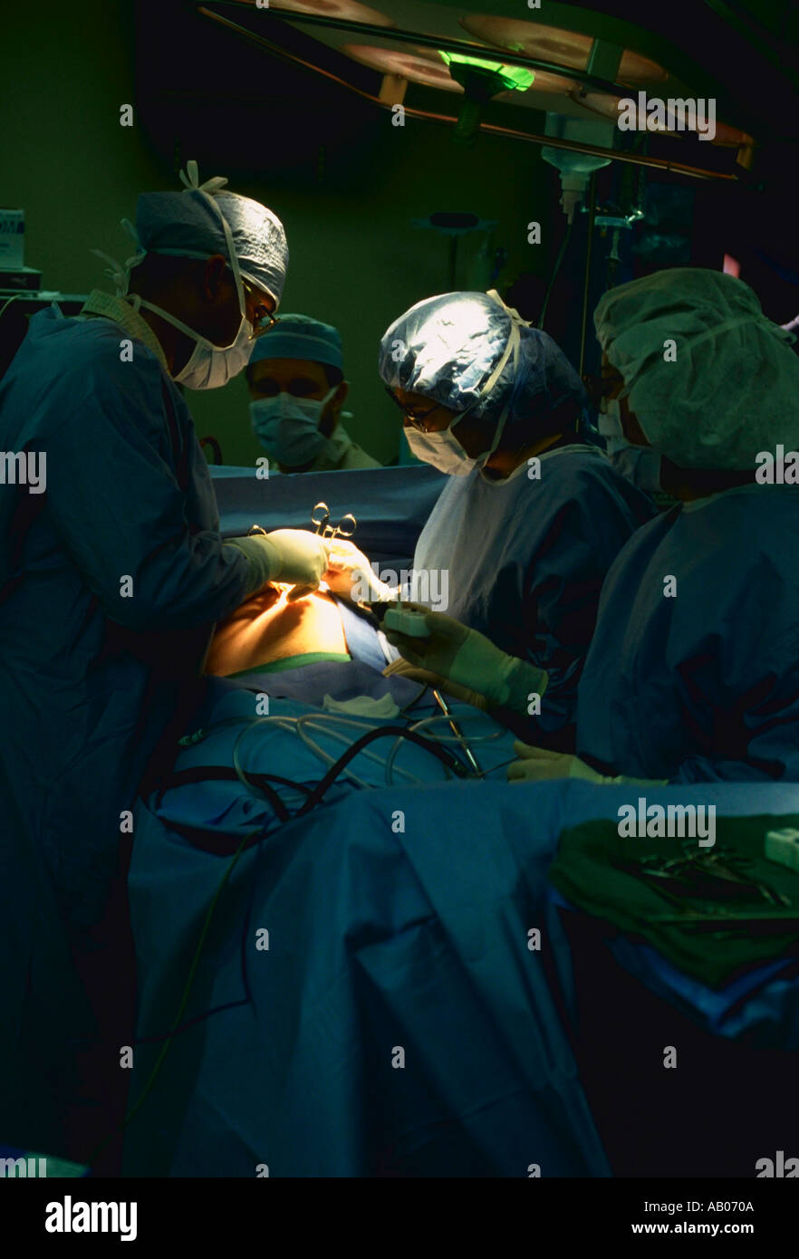 African American surgeon performing surgery in operating room Stock ...