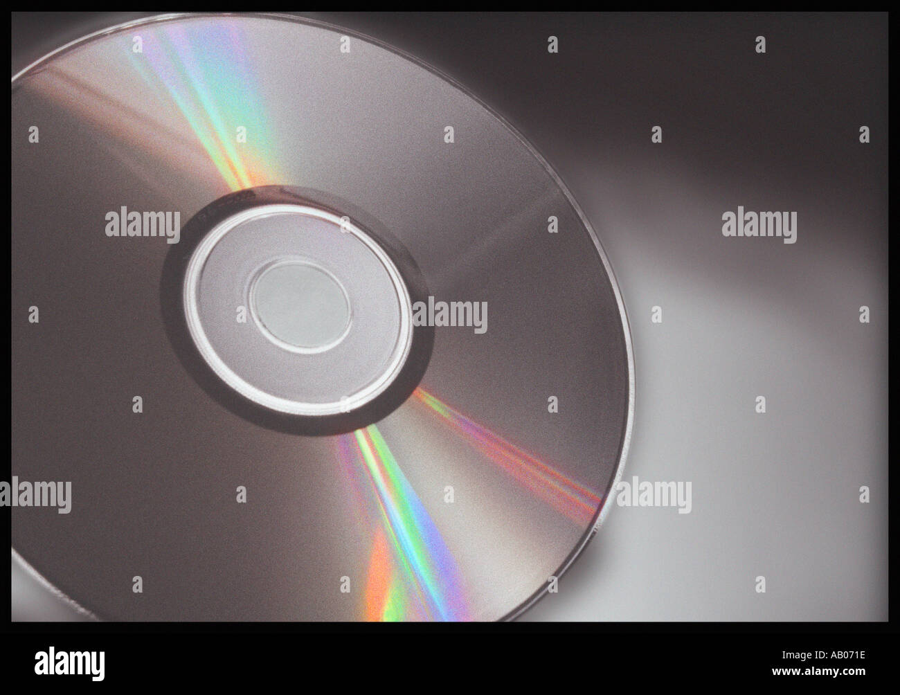 CD ROM reflecting light on a black background Stock Photo - Alamy