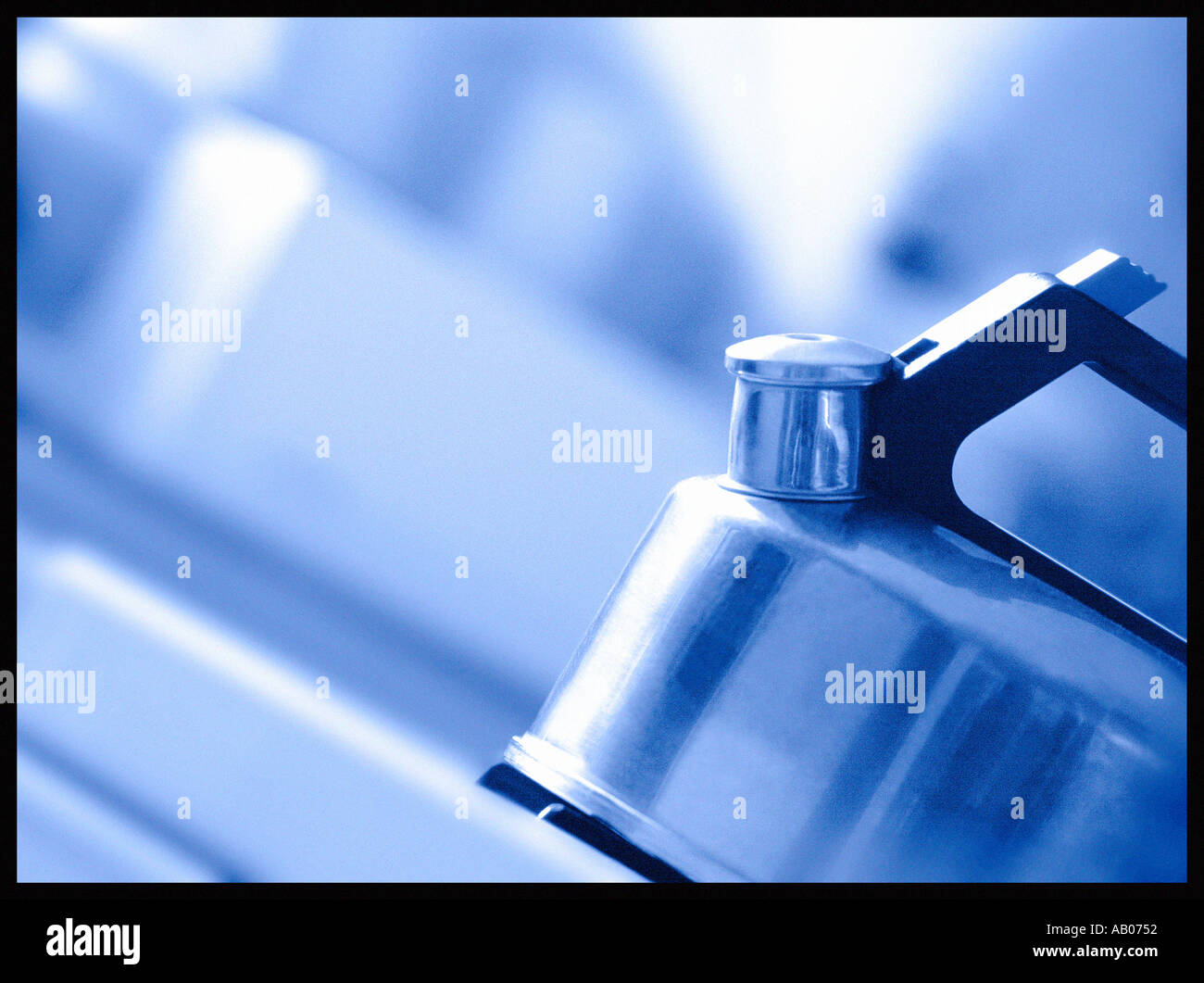 Teapot boiling on the stove with steam spraying out of the spout Stock ...