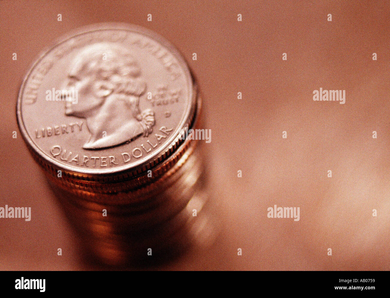 Stack of quarters with blurred background Stock Photo - Alamy