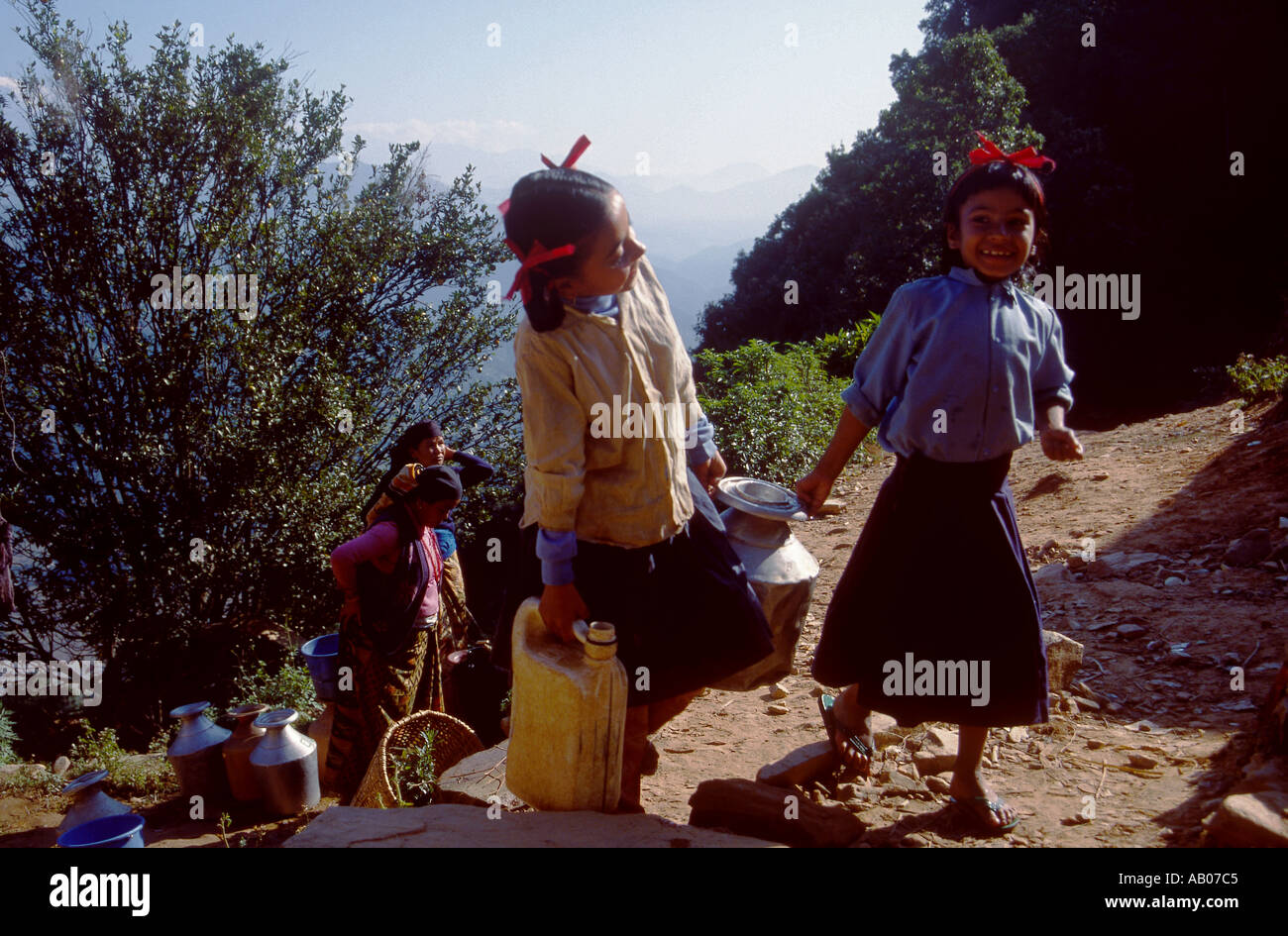 Women carrying water jars hi-res stock photography and images - Alamy
