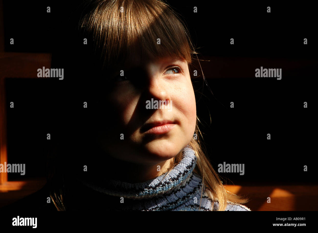 Young girl portrait with half face in deep shadow Stock Photo - Alamy