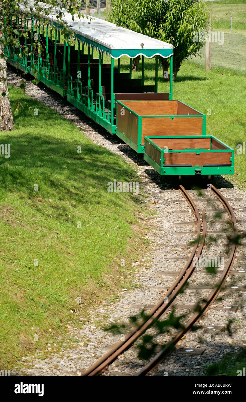 A ridable miniature railway track with carriages Stock Photo - Alamy