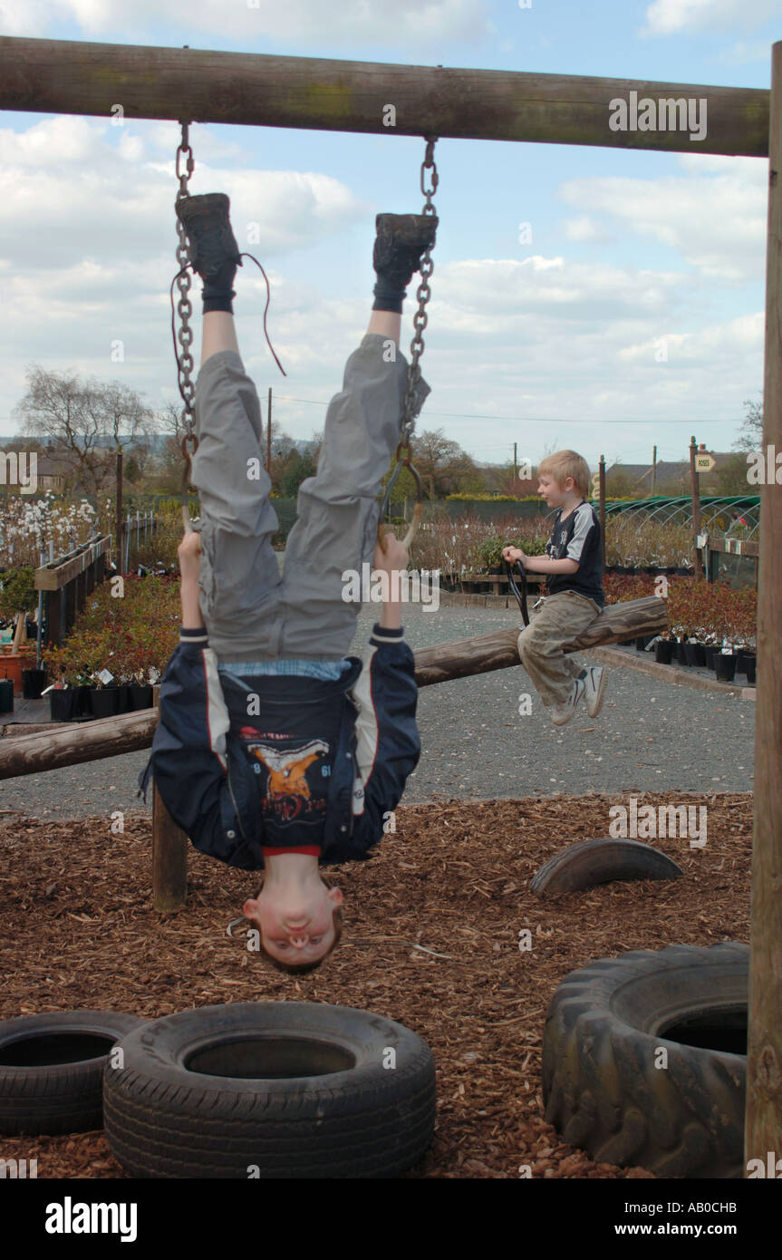 Boy Hanging Upside Down Stock Photo - Alamy