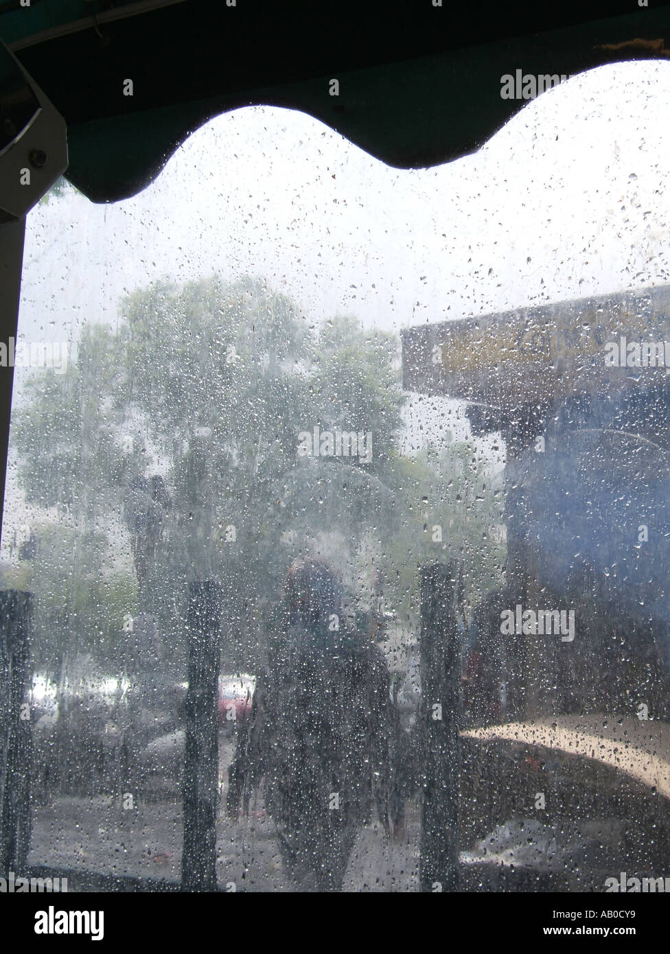 Man walking in the rain window hi-res stock photography and images - Alamy