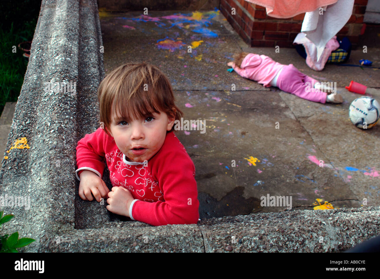Little Girls Playing In Back Yard Stock Photo - Alamy