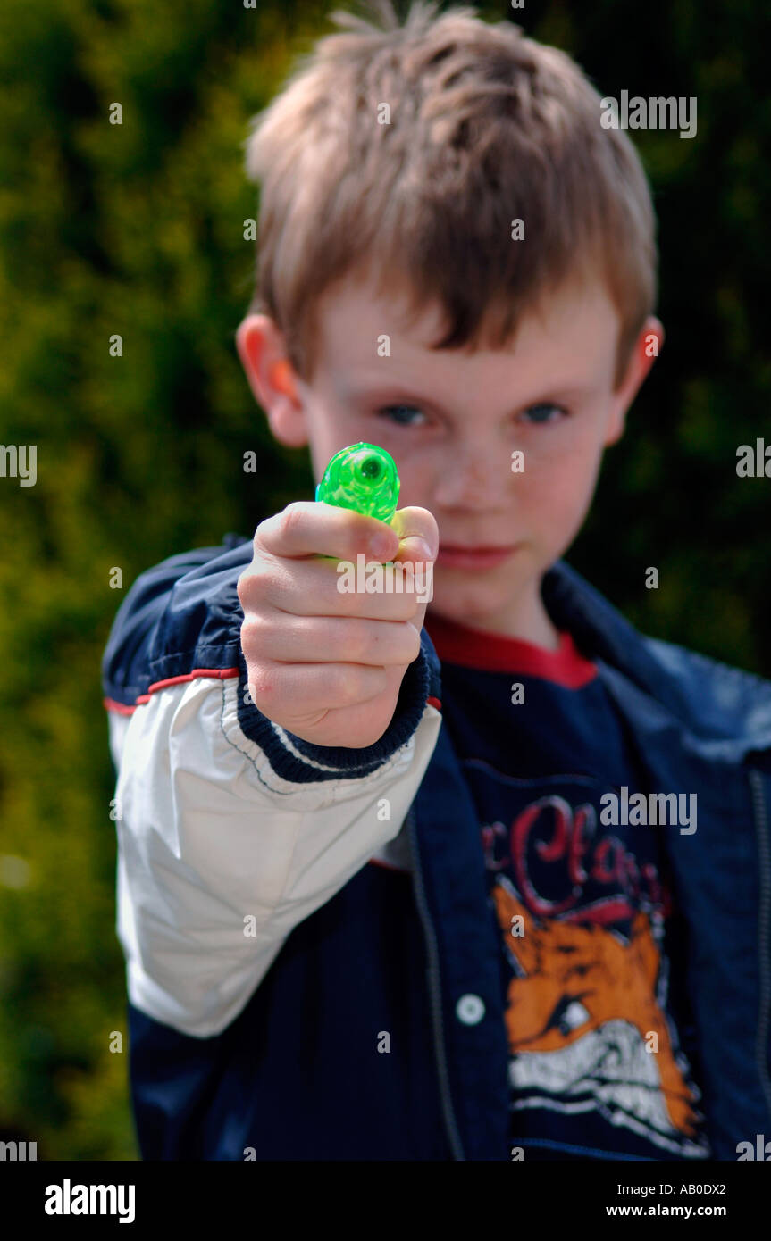 Boy Aiming A Water Pistol Stock Photo - Alamy