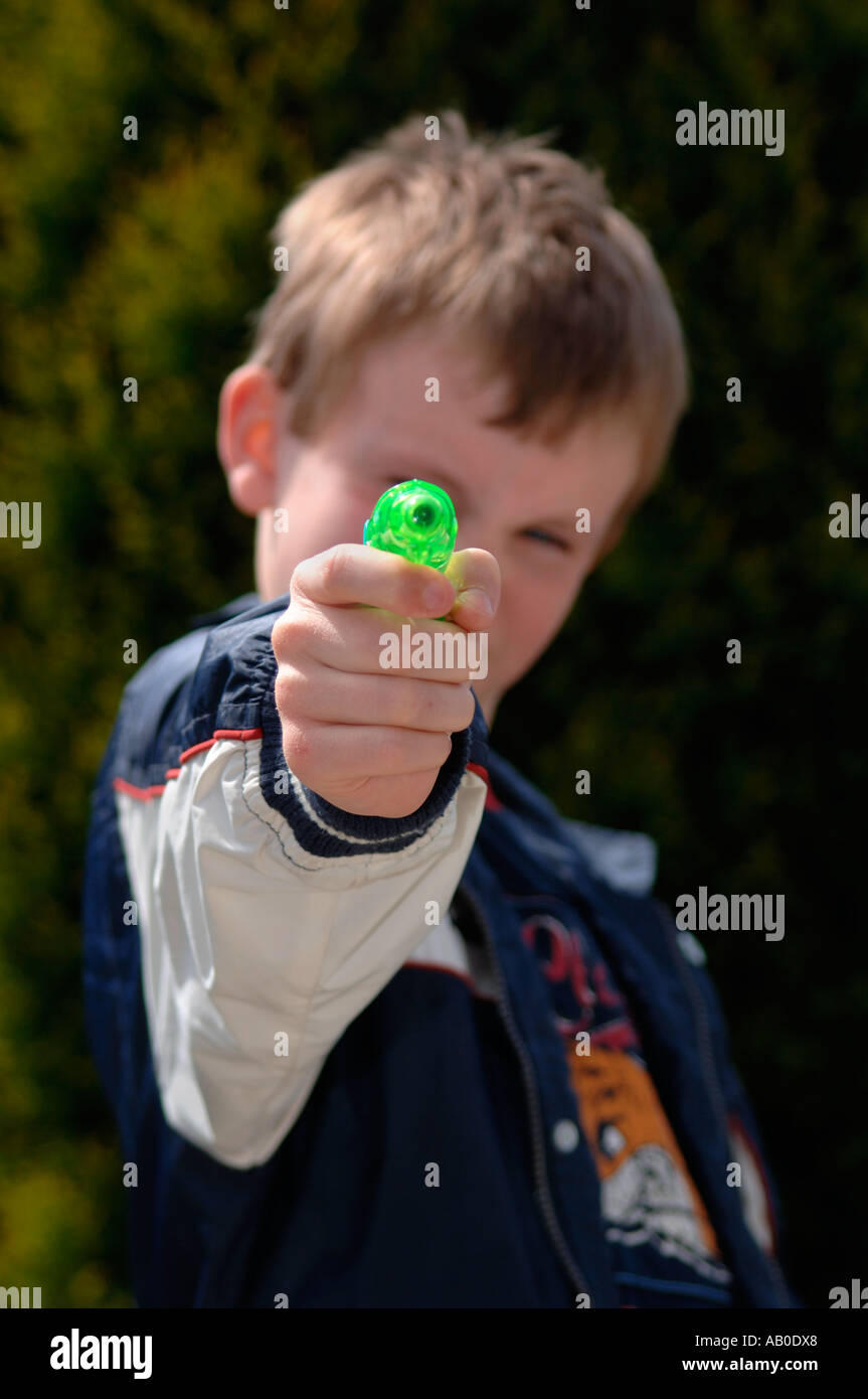 Boy Aiming A Water Pistol Stock Photo - Alamy
