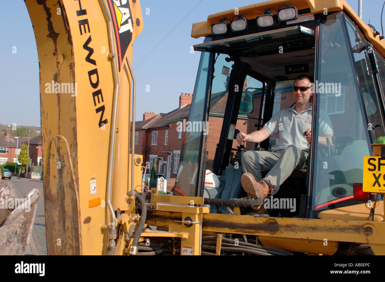 Man Operating A Digger Stock Photo - Alamy