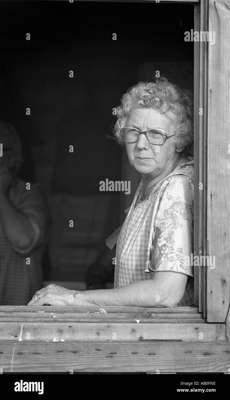 Old lady waiting in serving window of shed converted into ice cream ...