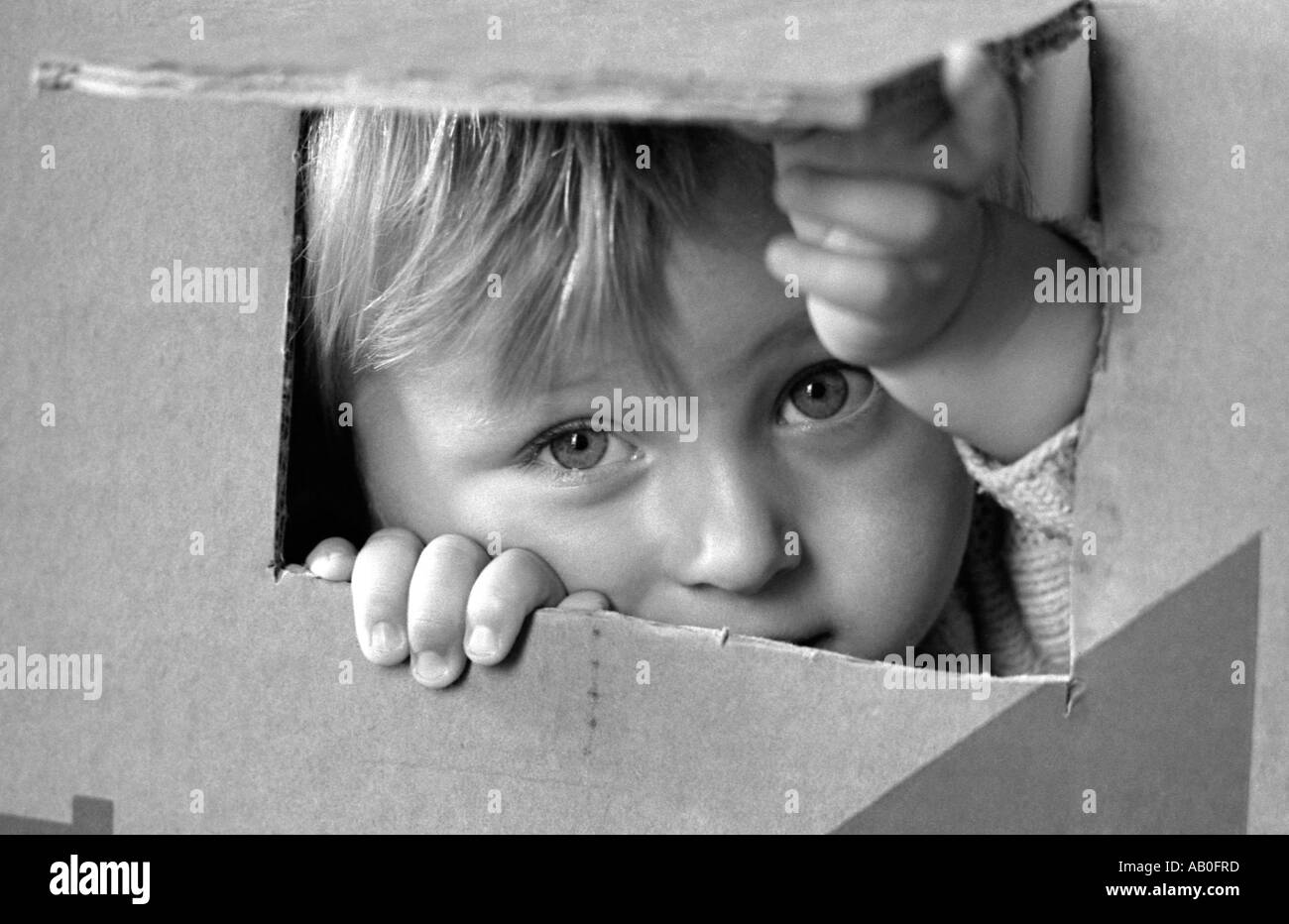Small boy playing with large cardboard box Stock Photo - Alamy