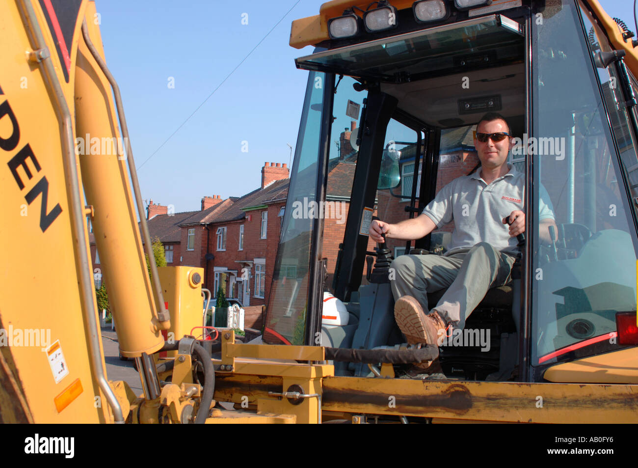 Man Operating A Digger Stock Photo - Alamy