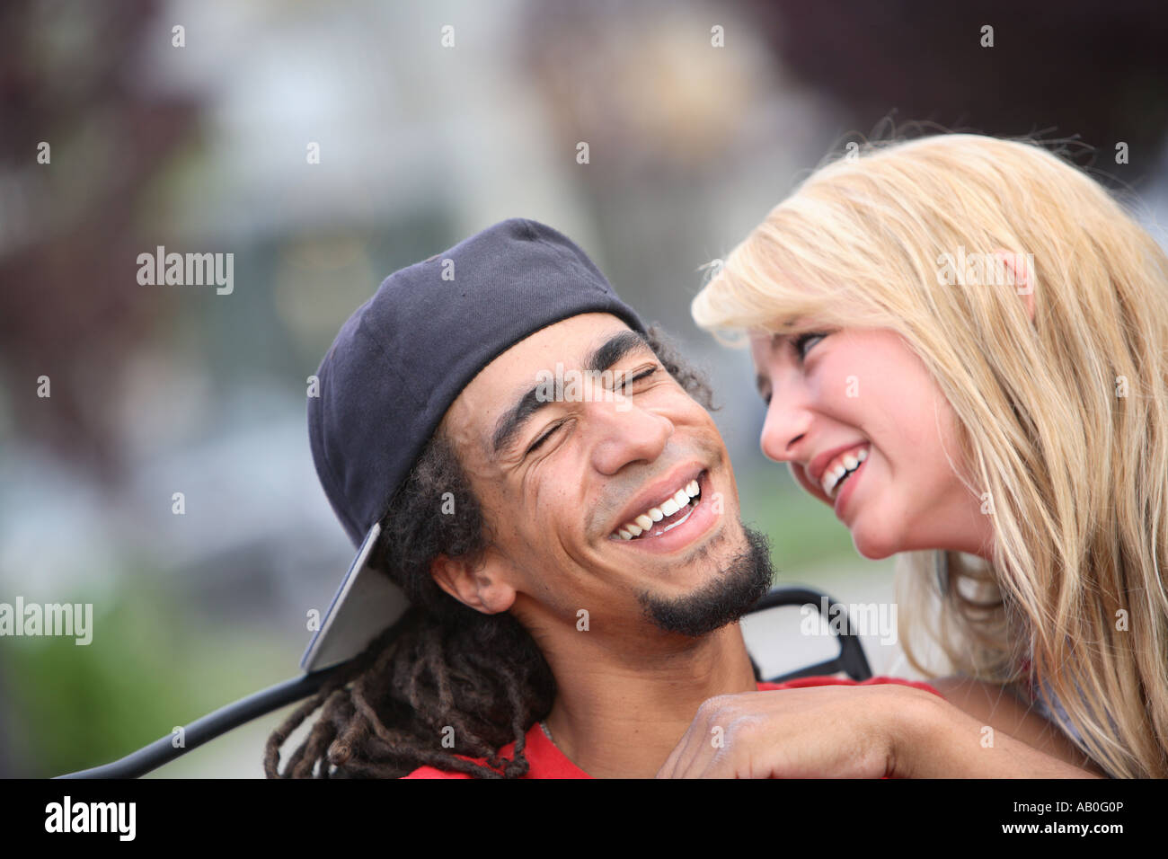 Young couple smiling together Stock Photo - Alamy