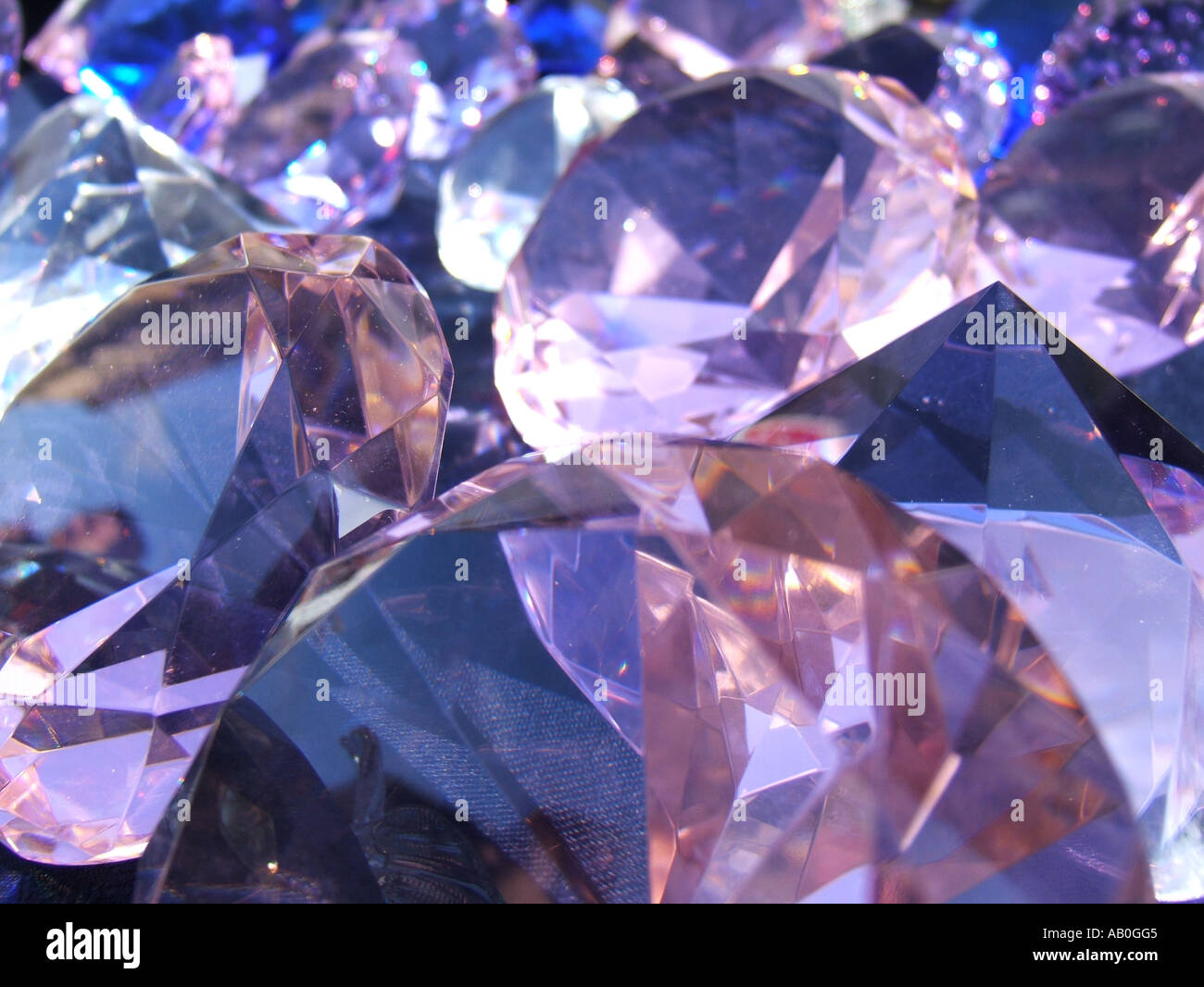 cut glass in diamond shape on blue background Stock Photo - Alamy