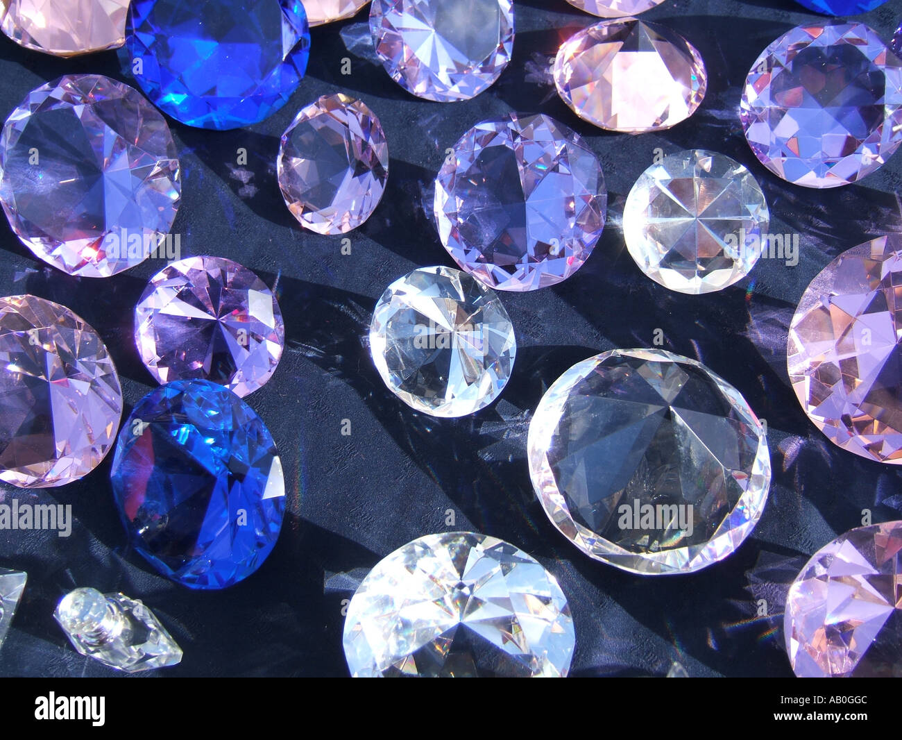cut glass in diamond shape on blue background Stock Photo - Alamy