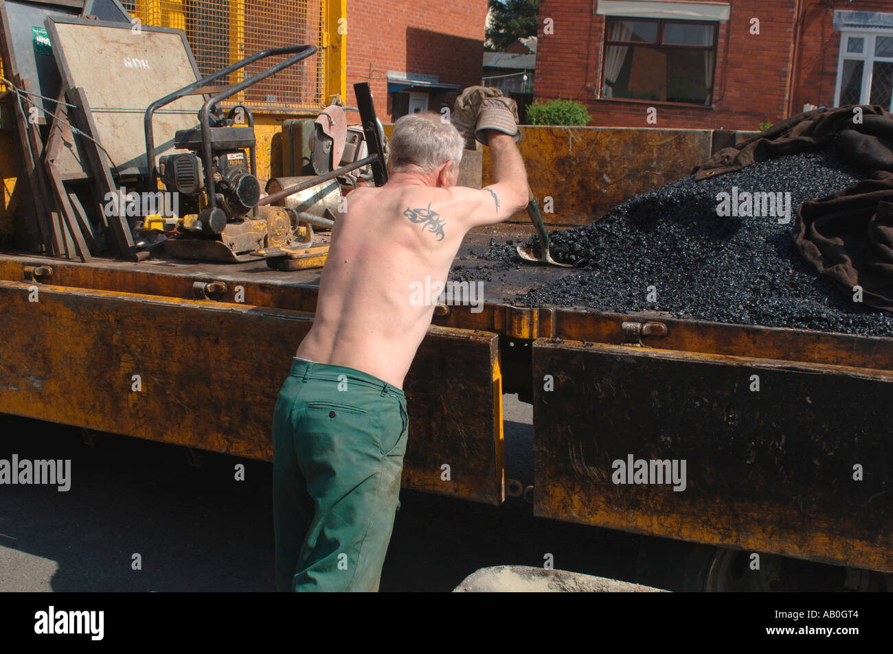 Man Working On Dropping A Curb Stock Photo - Alamy