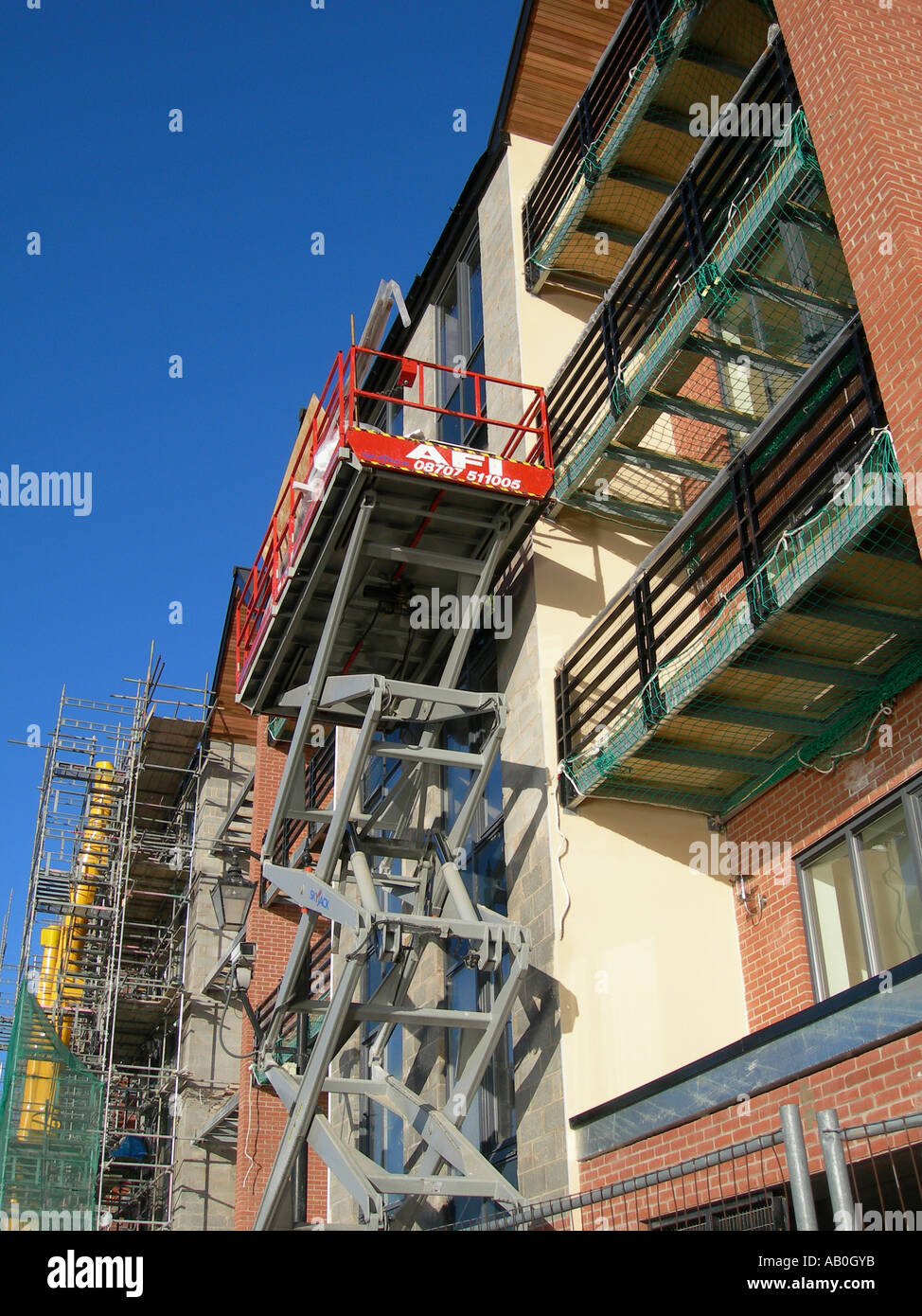 Manlift or flying platform in use to work safely at height on a ...