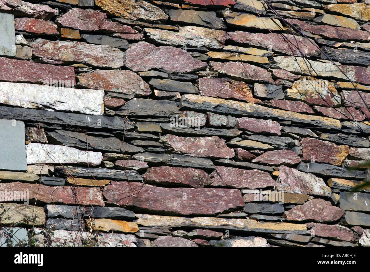 Detail of slate and stone dry wall of building in Bowness in the ...