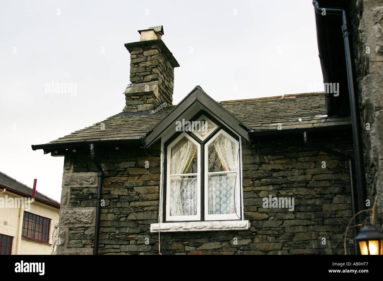 Window on old stone and slate built house in the English Lake District ...