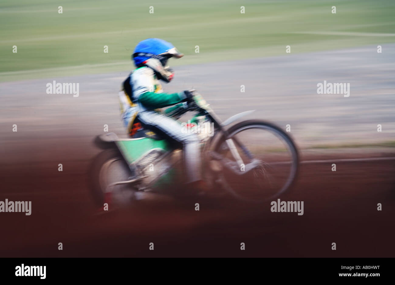 Speedway riders in motion blur Stock Photo - Alamy
