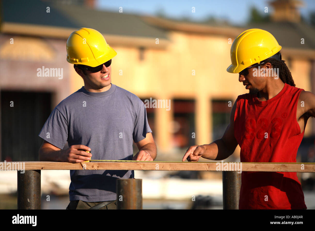 Construction workers working together Stock Photo - Alamy