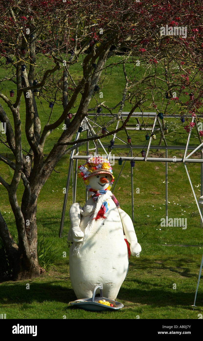 Fun image of artificial snowman dressed in colourful easter attire ...
