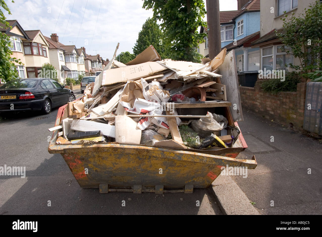 Overloaded skip hi-res stock photography and images - Alamy