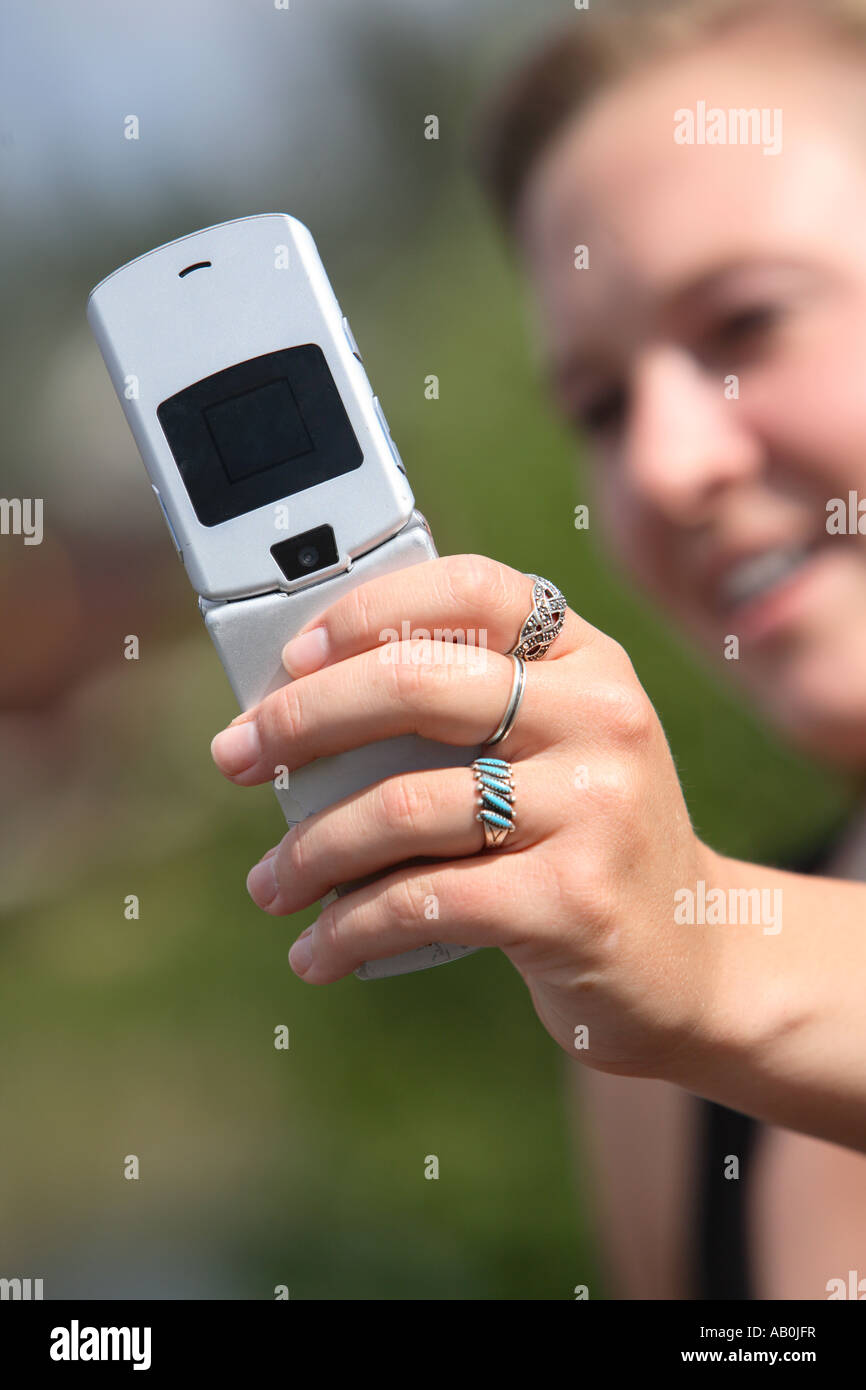 Young woman using cell phone Stock Photo - Alamy