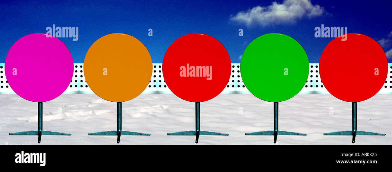 Five Coloured Table Tops With Snow And Sun Stock Photo - Alamy