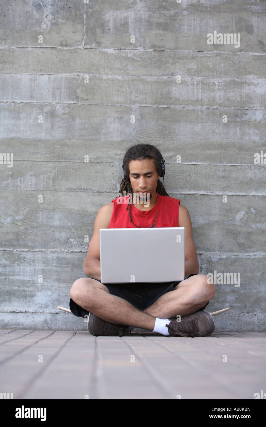 Young man using a laptop hi-res stock photography and images - Alamy